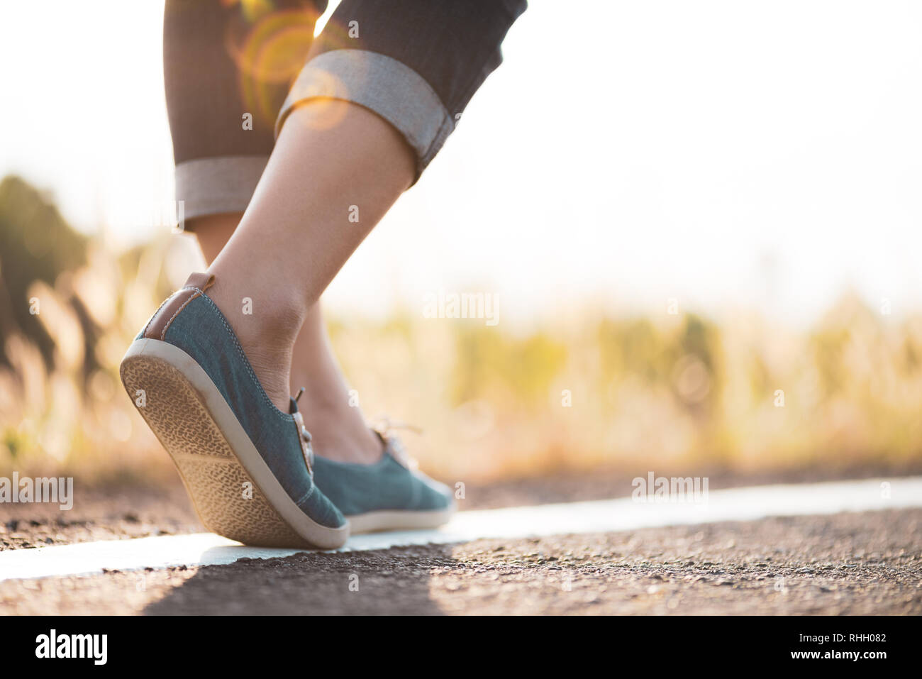 Closeup woman walking towards on the road side. Step concept Stock ...