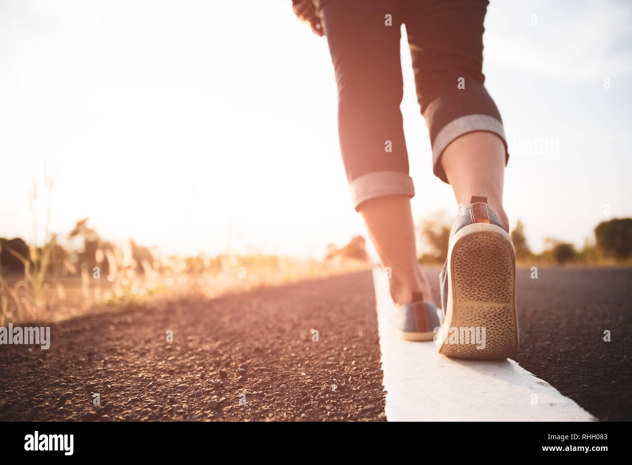 Closeup woman walking towards on the road side. Step concept Stock ...