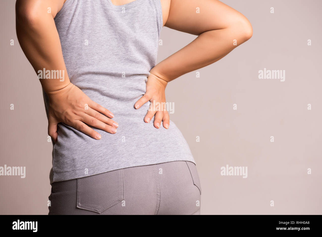 Close up woman having pain in injured back. Healthcare and back pain ...