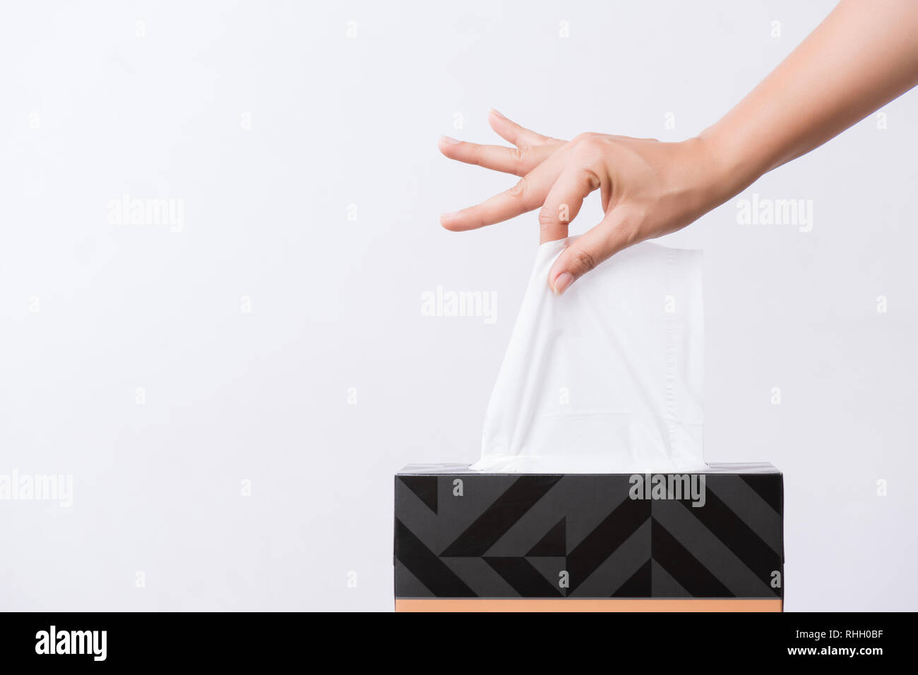 Healthcare concept. Woman hand picking white tissue paper from tissue ...