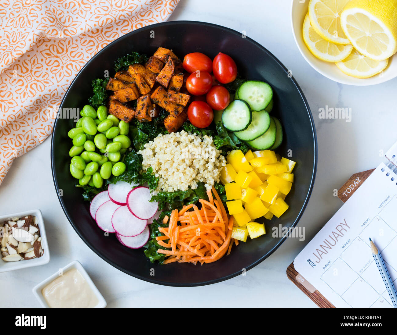 Aerial- healthy kale salad bowl w/ vegetables- sweet potato, tomato ...
