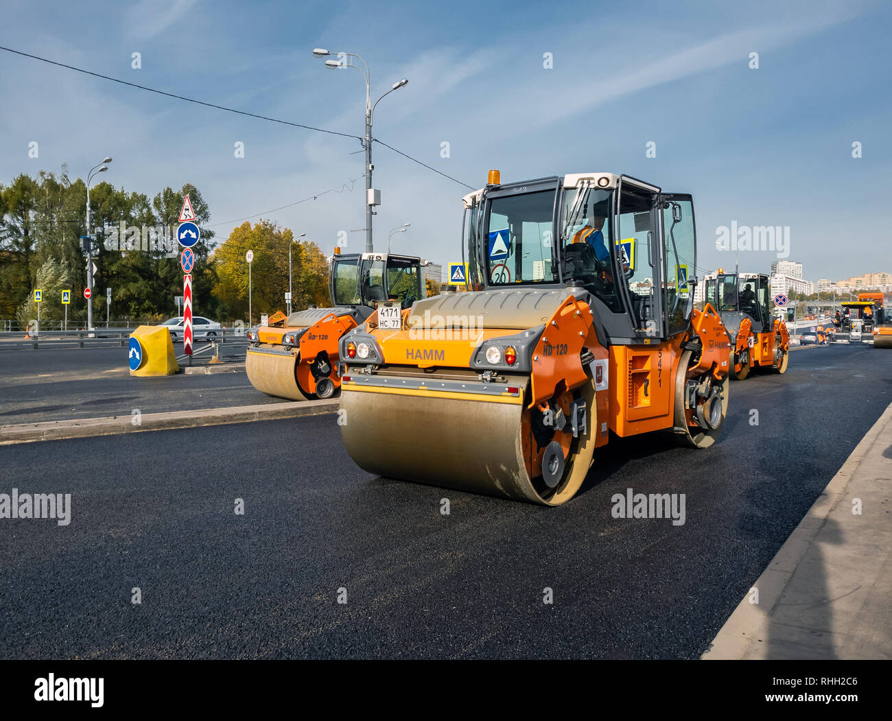 Moscow, Russia -October 9. 2018. Asphalt pavement repair using asphalt ...