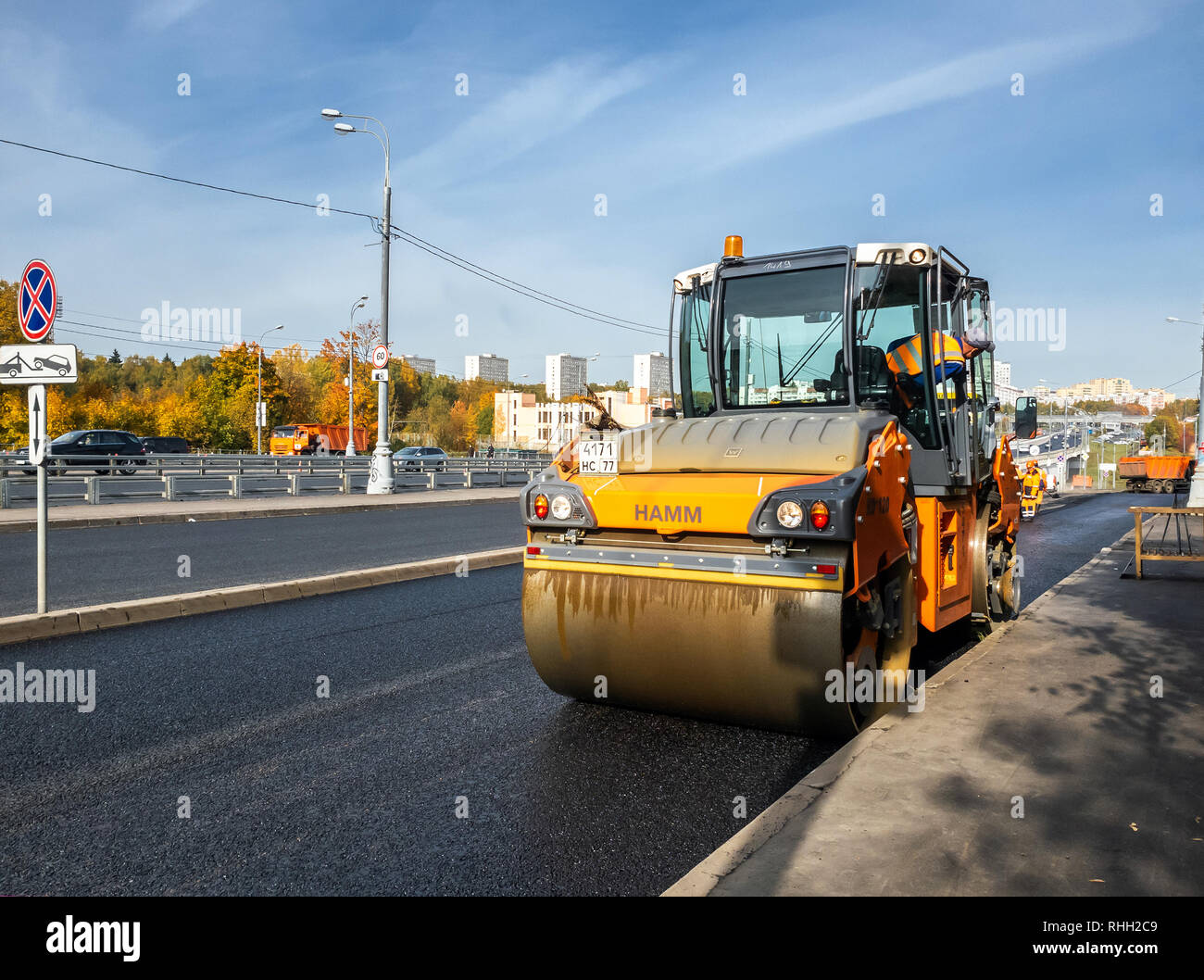 Moscow, Russia -October 9. 2018. Asphalt pavement repair using asphalt ...