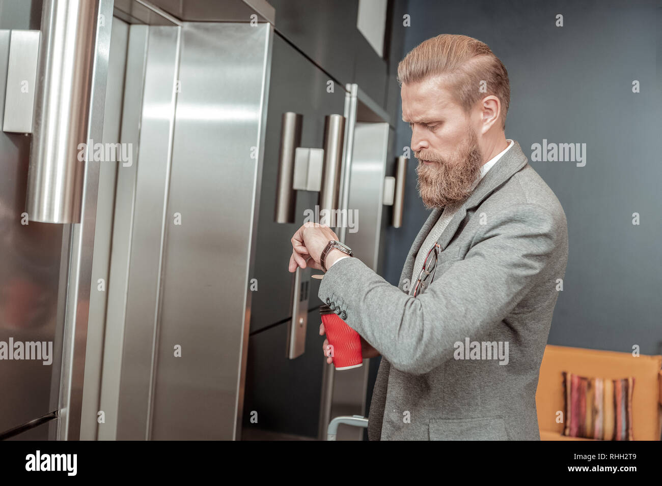 Serious young businessman checking hi-res stock photography and images ...