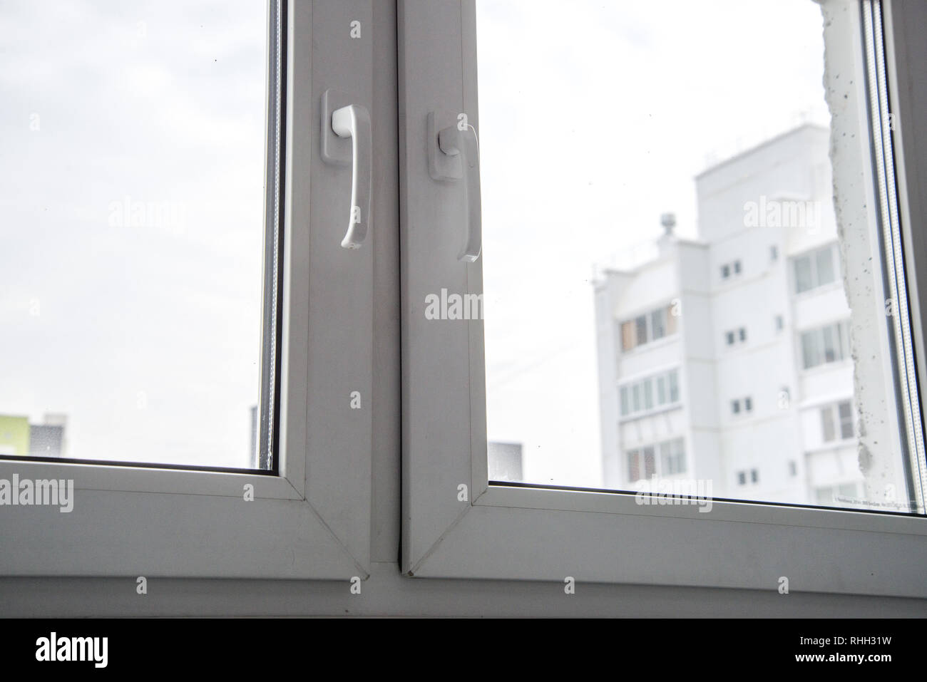 Open window. PVC plastic. View of the street from the window of a new ...