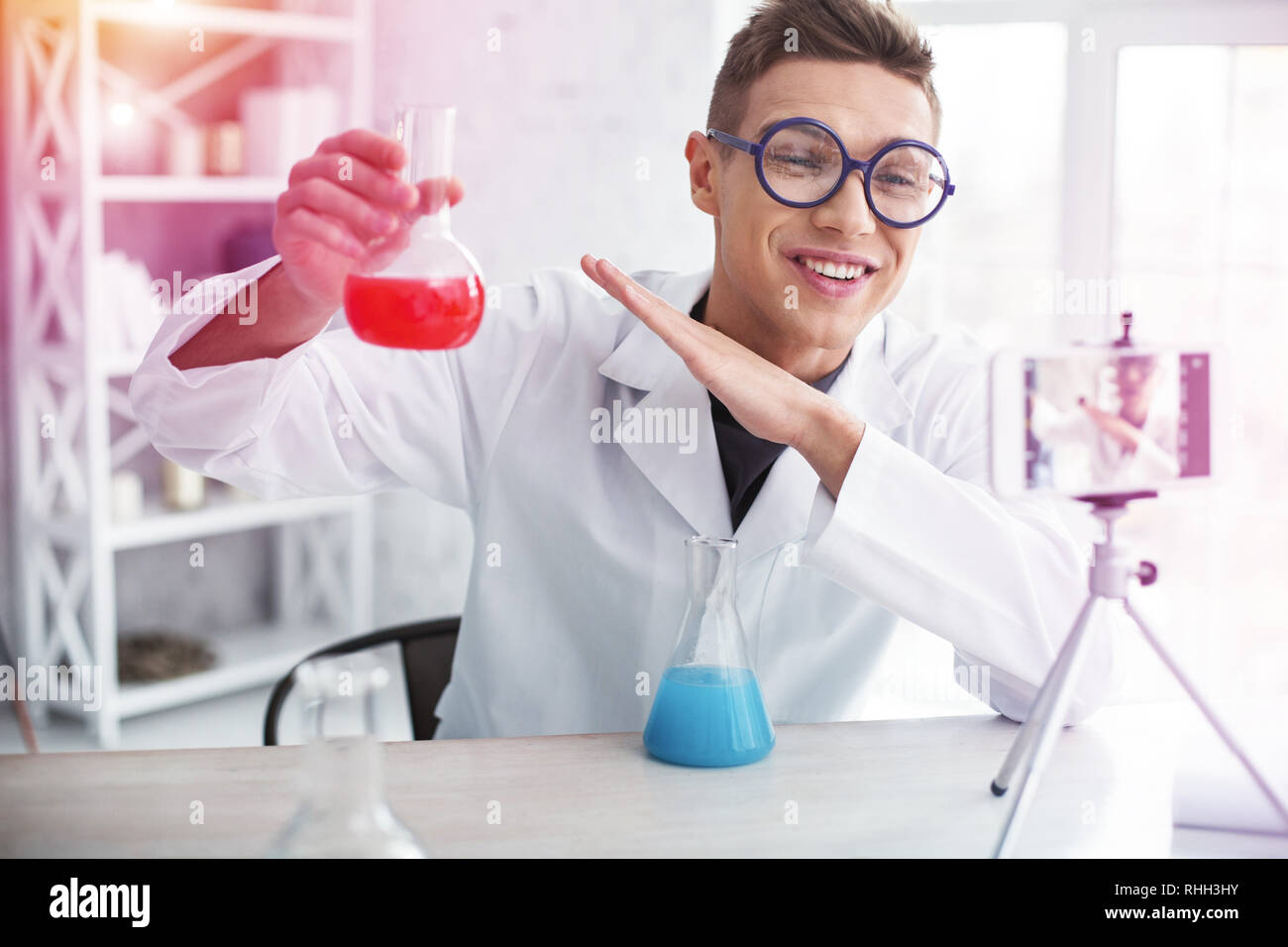 Handsome smart student feeling happy after successful chemistry ...