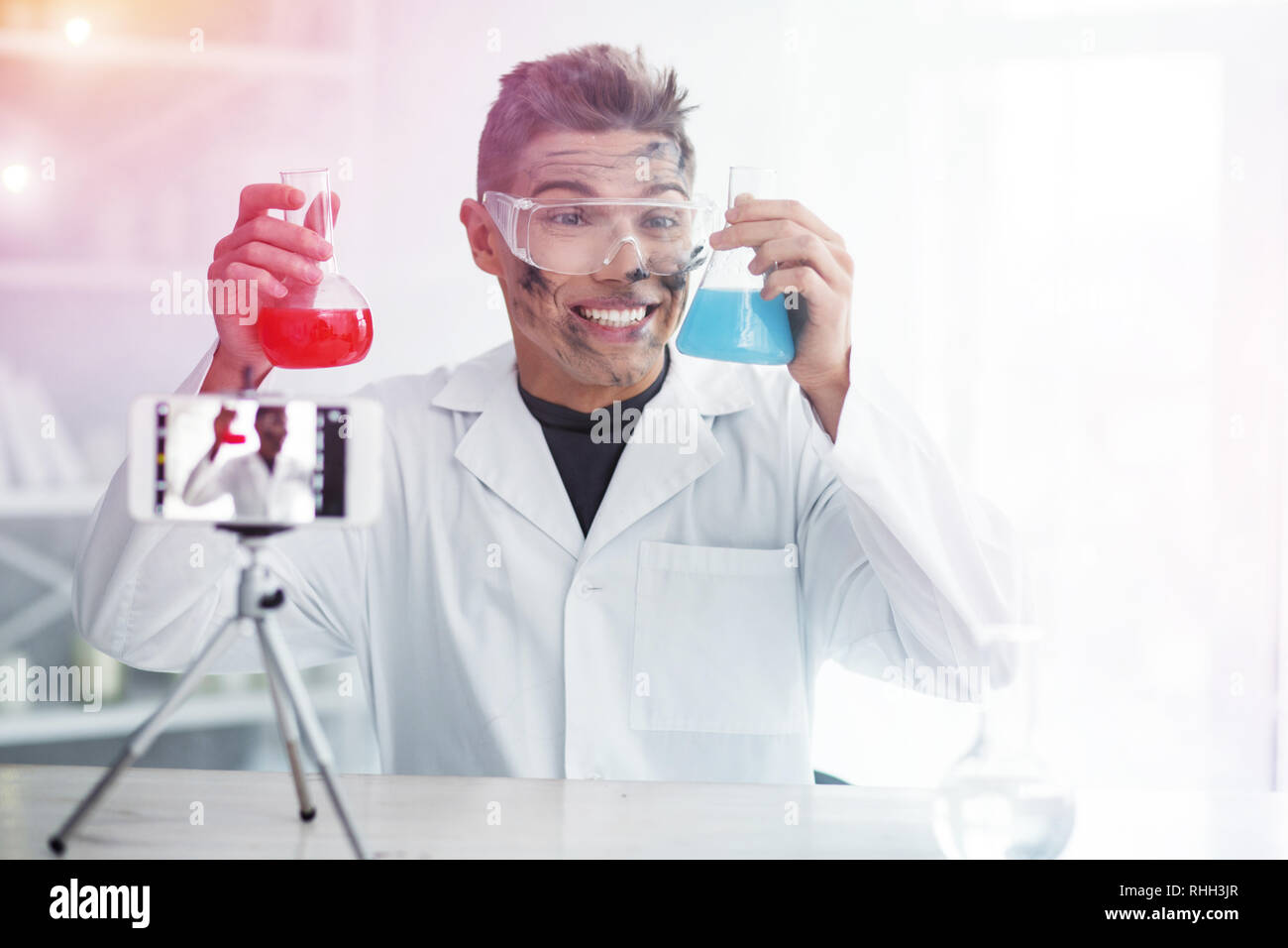 Smiling student feeling cheerful even after unsuccessful chemistry ...