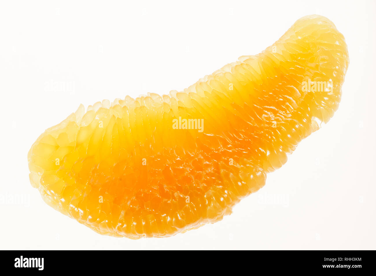 Peeled pomelo slice on a white background. Pomelo fruit macro ...