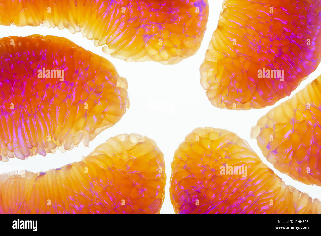 Pomelo fruit macro photography. Peeled pomelo slice on a white ...