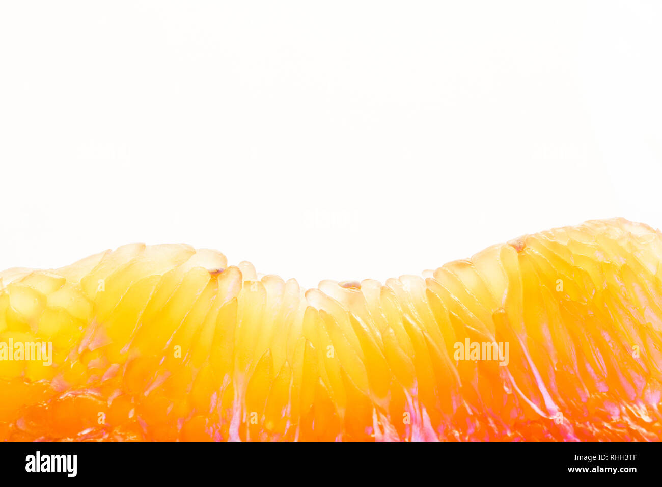 Pomelo fruit macro photography. Peeled pomelo slice on a white ...
