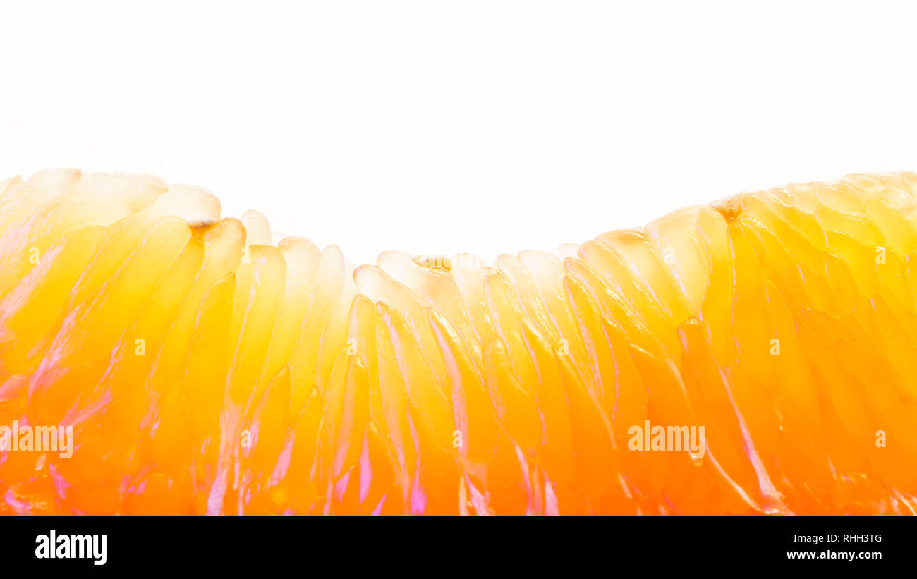 Pomelo fruit macro photography. Peeled pomelo slice on a white ...