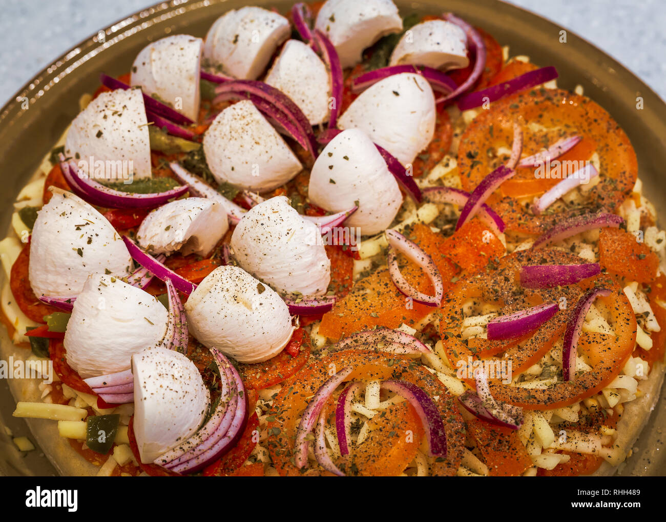 Fresh Half and Half Pizza Ready for the Oven Stock Photo - Alamy