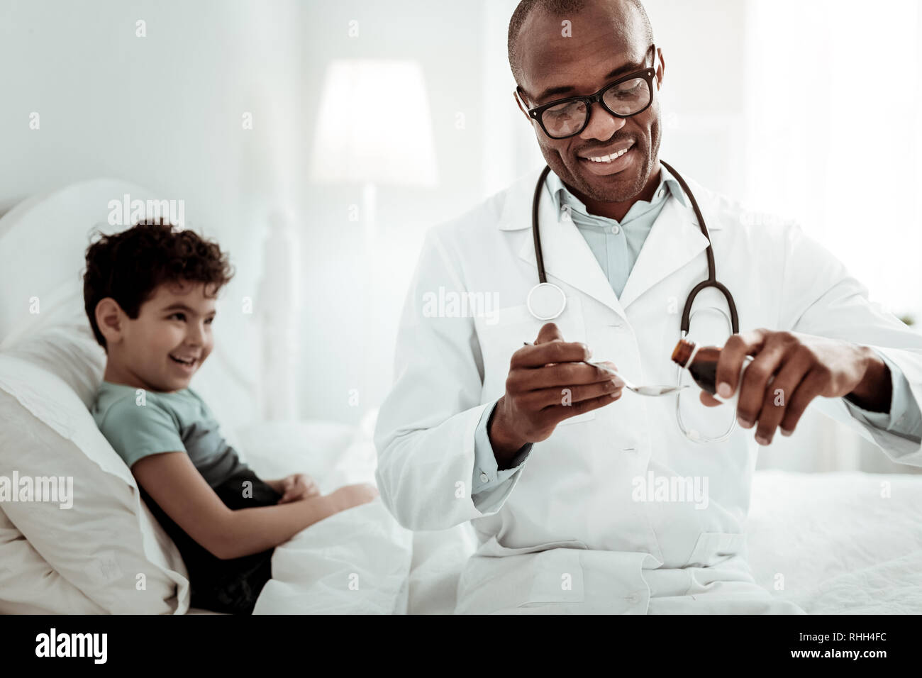 Positive delighted male person treating his patient Stock Photo - Alamy