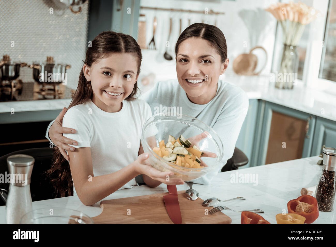 Happy mother and daughter spending time on cooking Stock Photo - Alamy