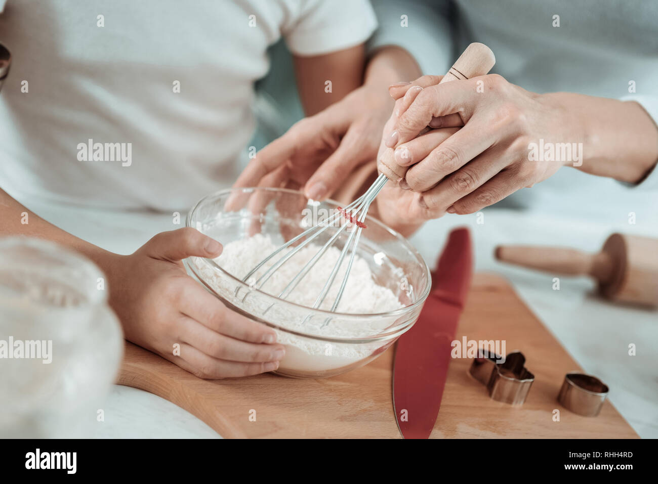 Nice woman and a child cooking together in the kitchen Stock Photo - Alamy