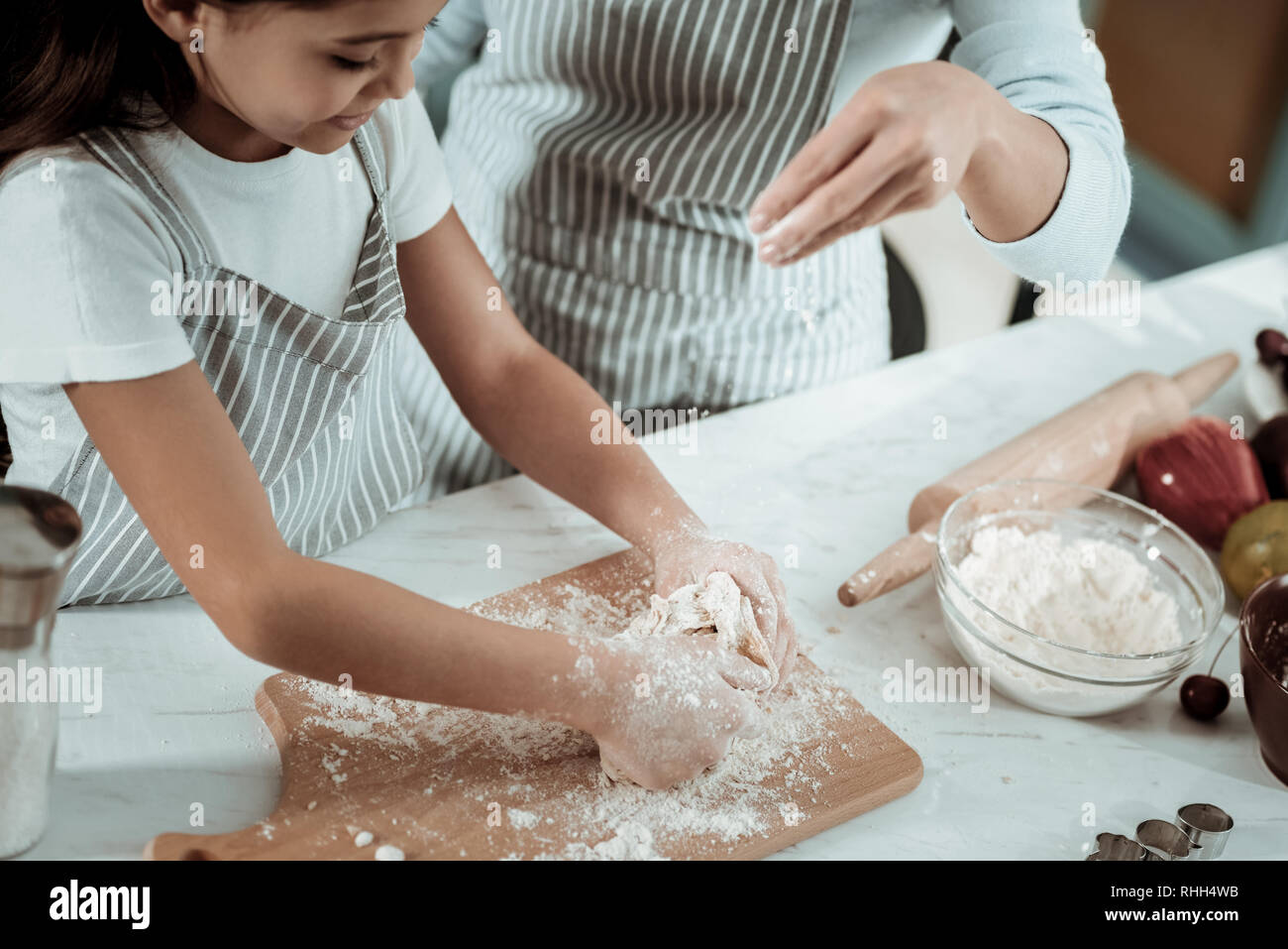 Small kid cooking a tasty dinner with mother Stock Photo - Alamy