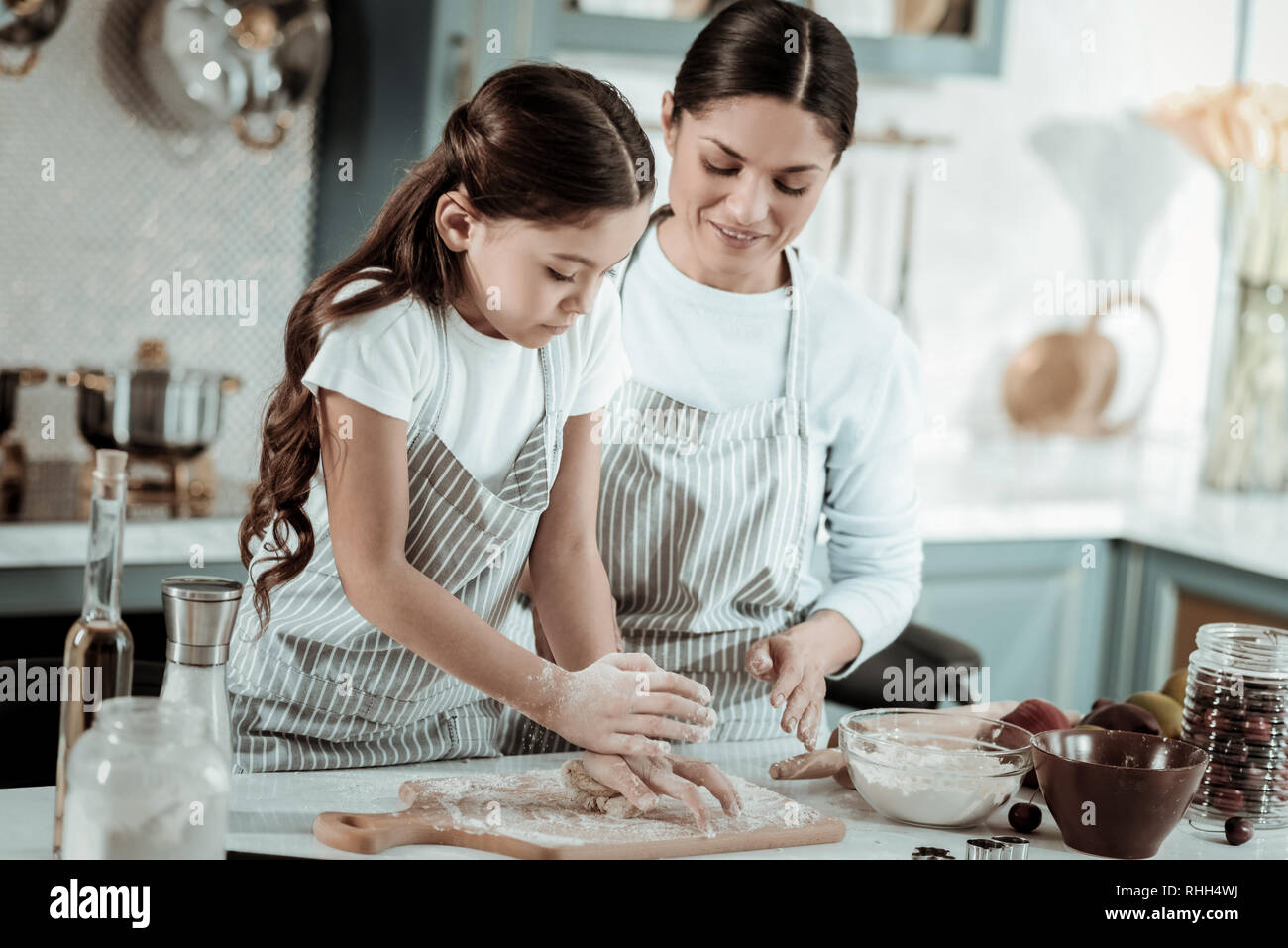 Hardworking child doing the best to cook a tasty dinner Stock Photo - Alamy
