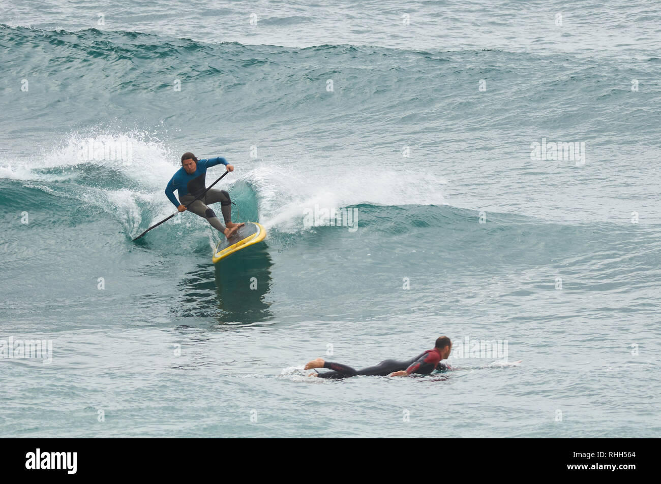 Paddle surfer riding a wave at the XIII Salinas International Longboard ...