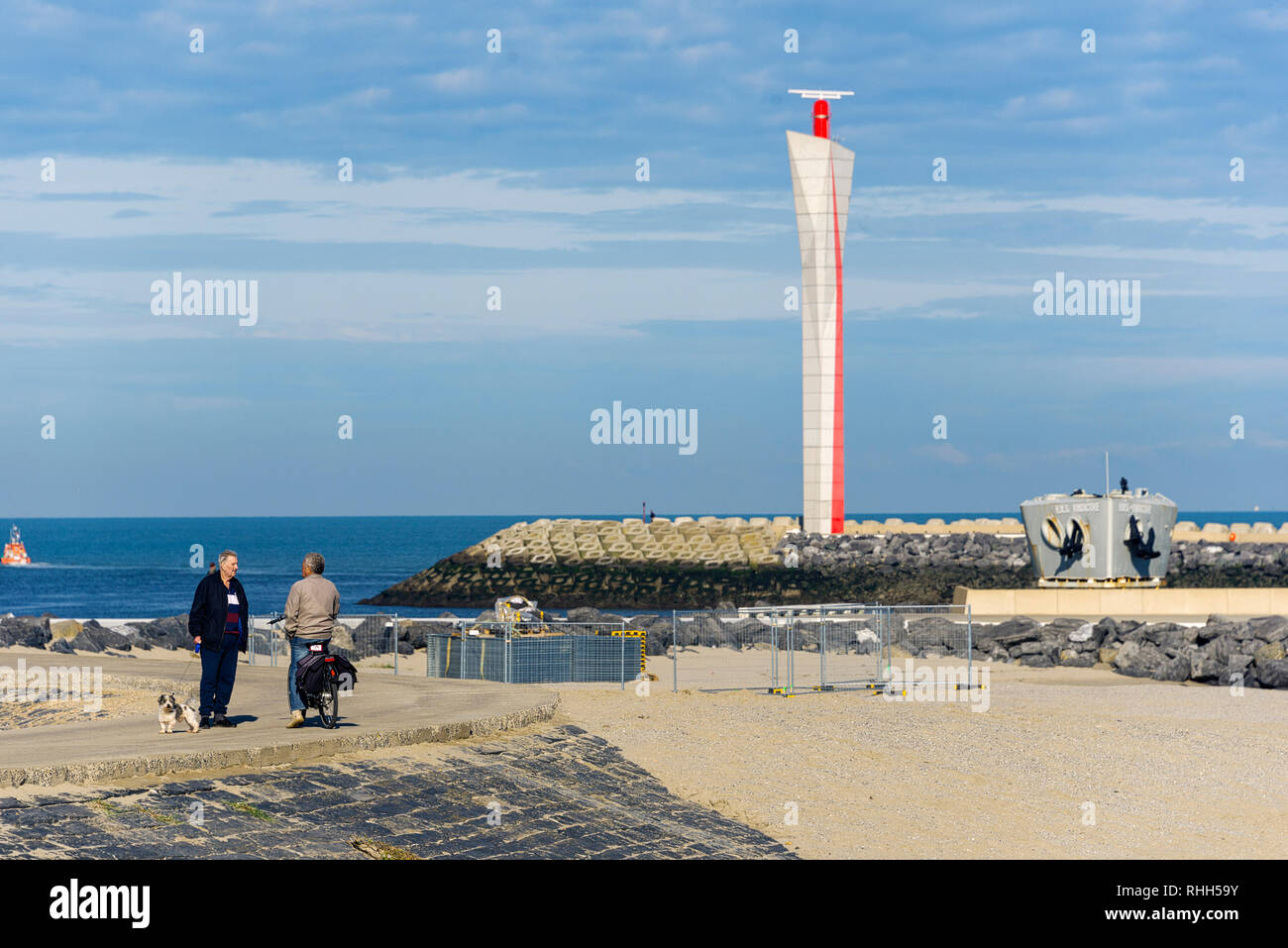 big stone wave breaker with Harbor Control Tower in Ostend, Belgium ...
