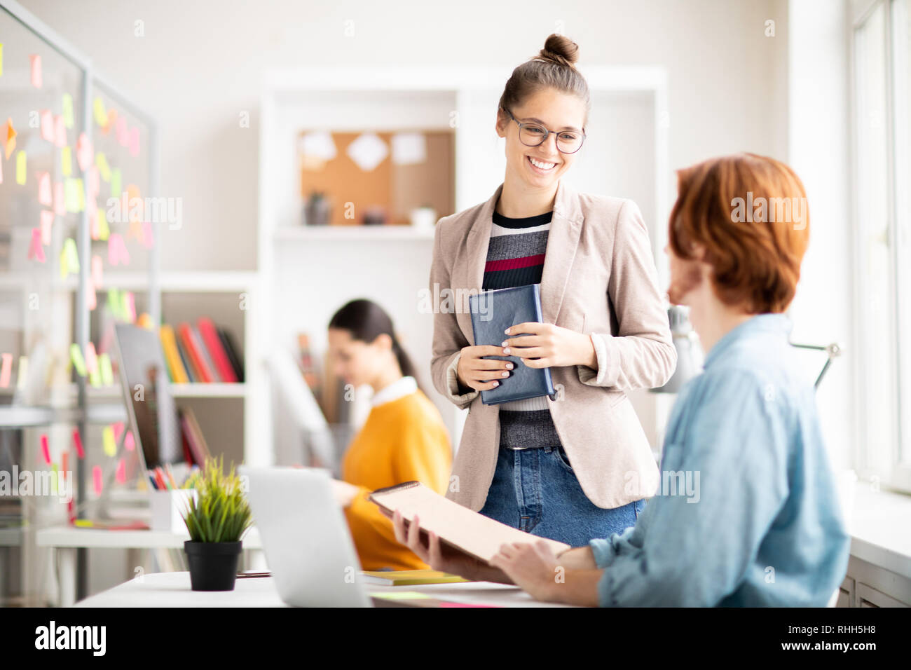 Discussing working questions Stock Photo - Alamy