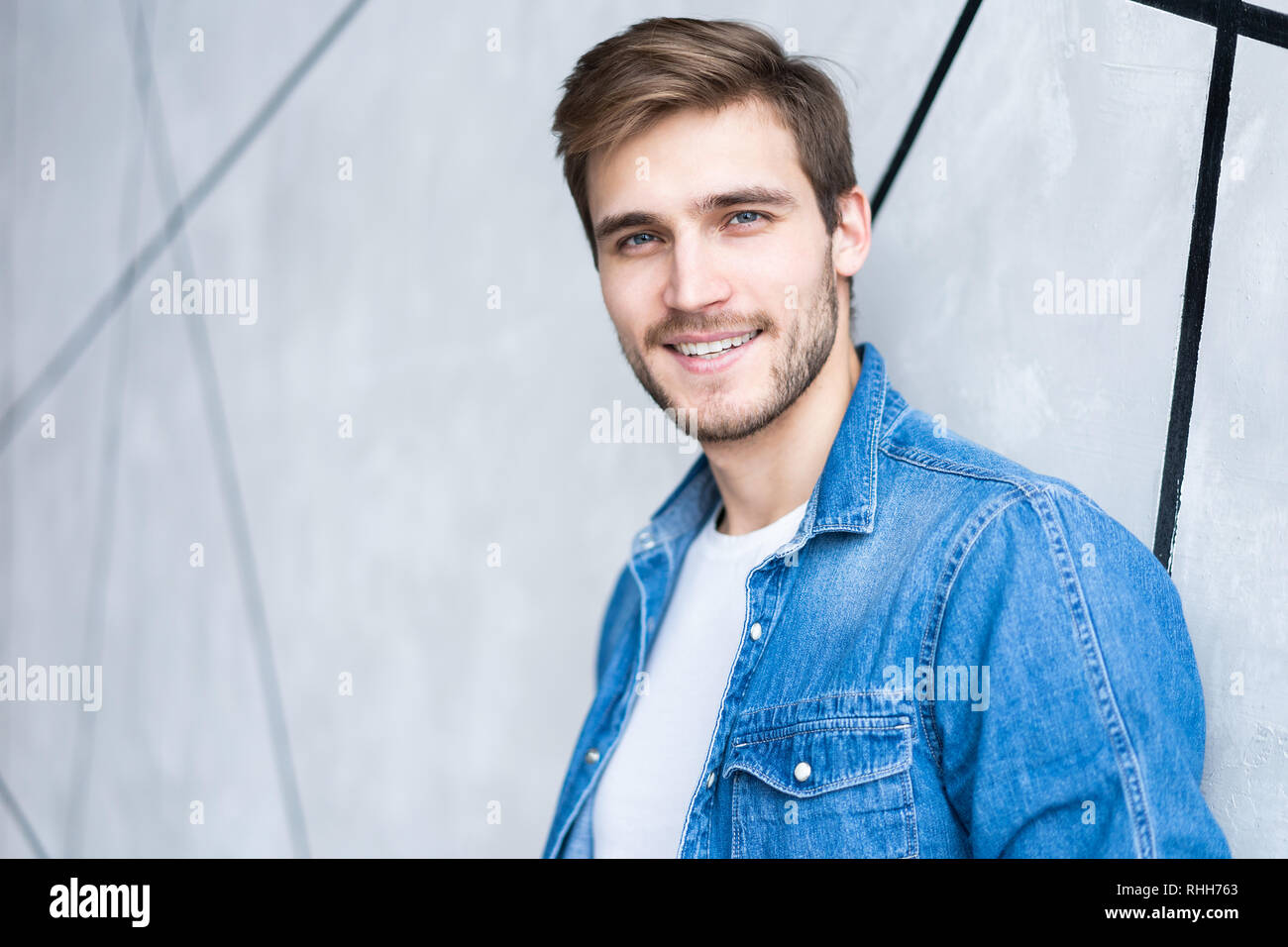 Handsome man in jeans shirt hi-res stock photography and images - Alamy