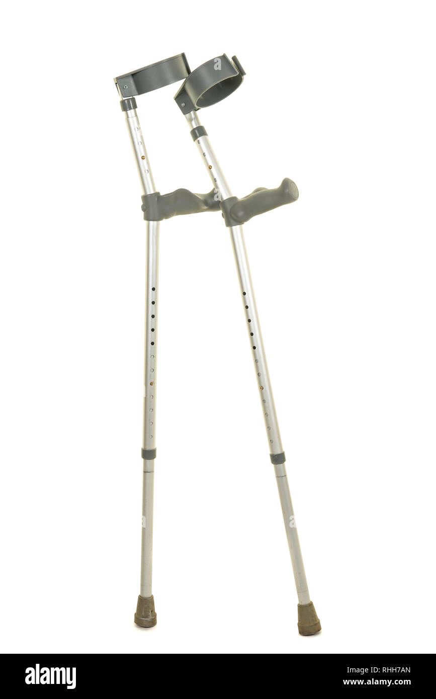 Pair of crutches isolated on a white background Stock Photo - Alamy