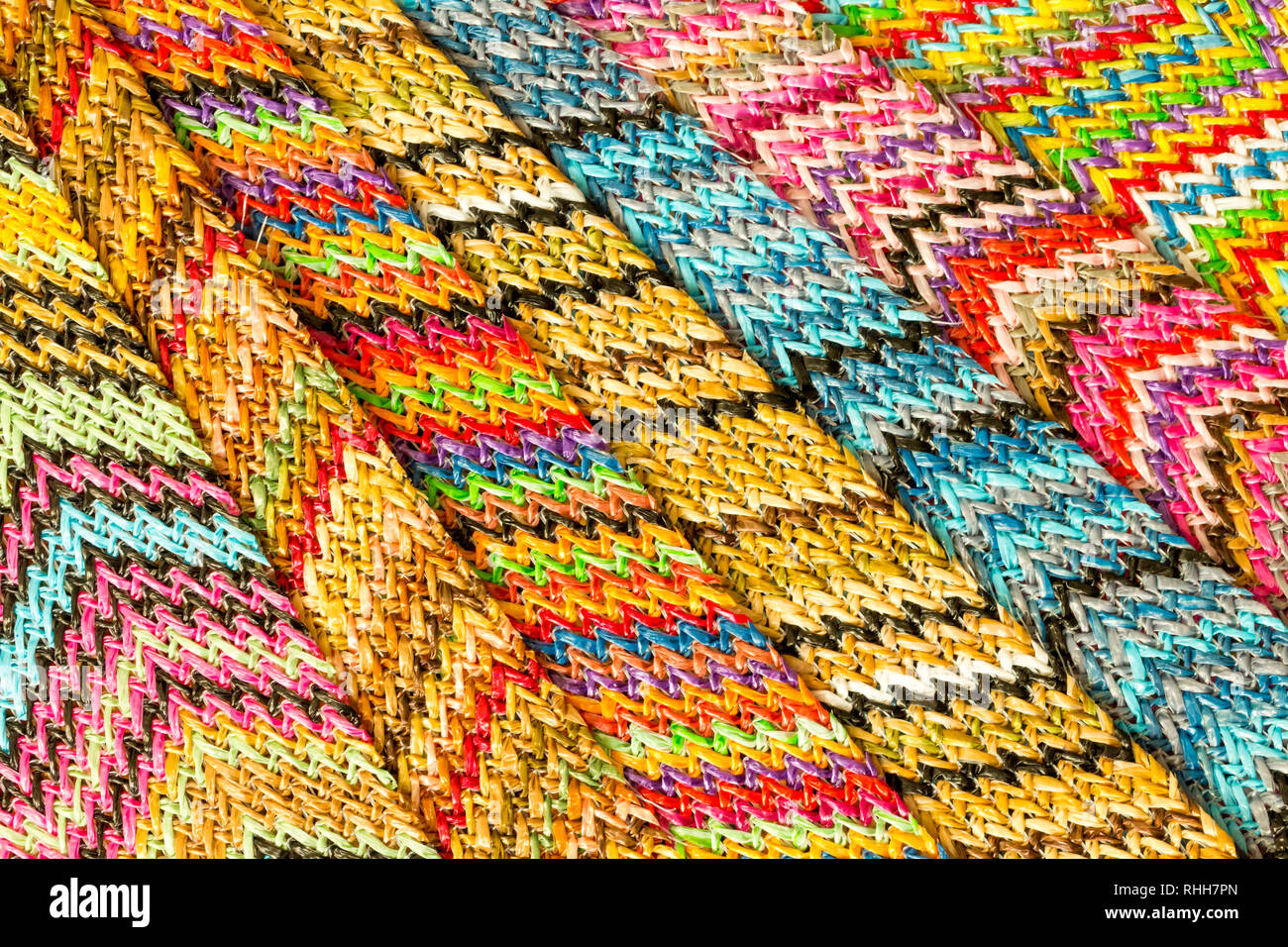 An abstract textured background design of multicolored zigzag woven ...