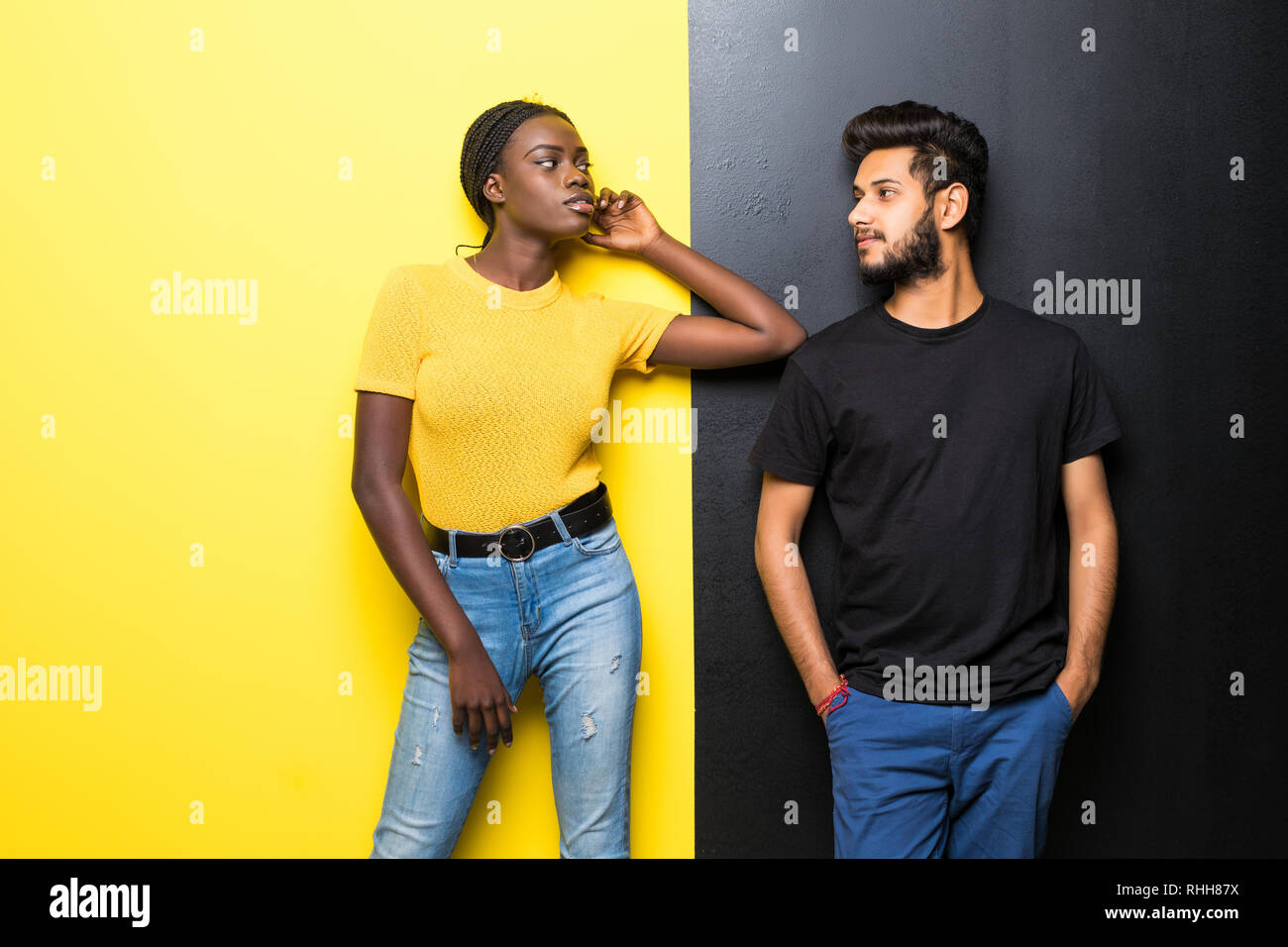 Young mixed race couple indian man and african woman standing isolated ...