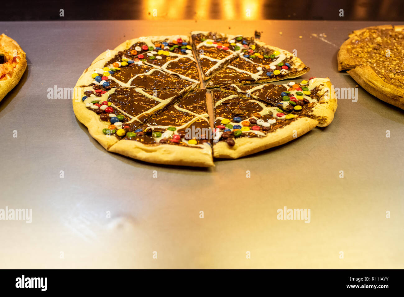 Chocolate pizzas and sweets in a restaurant Stock Photo - Alamy