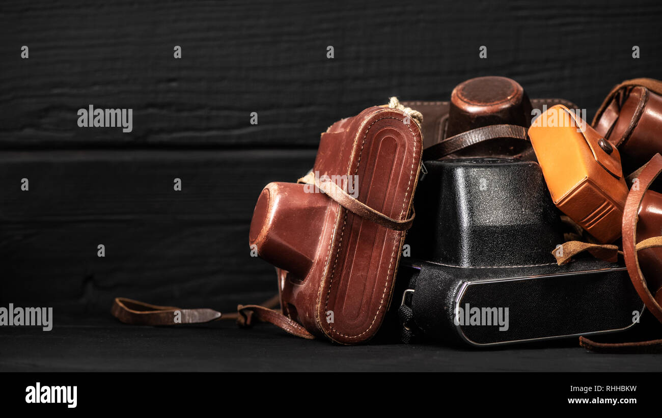 Retro cameras in leather covers. Collection of old things and antiques ...