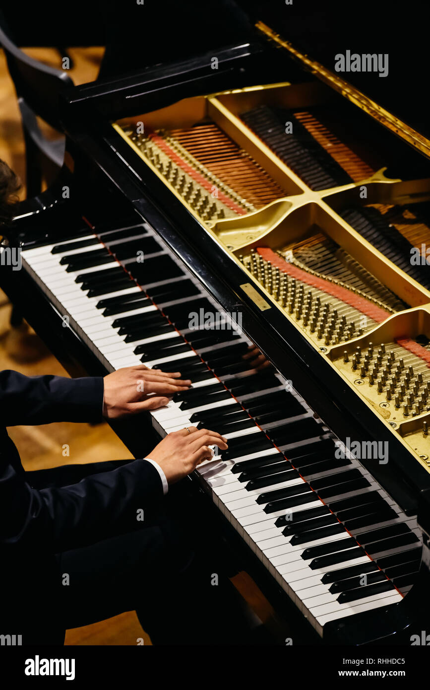 Hands of classical pianist playing his piano during a concert Stock ...