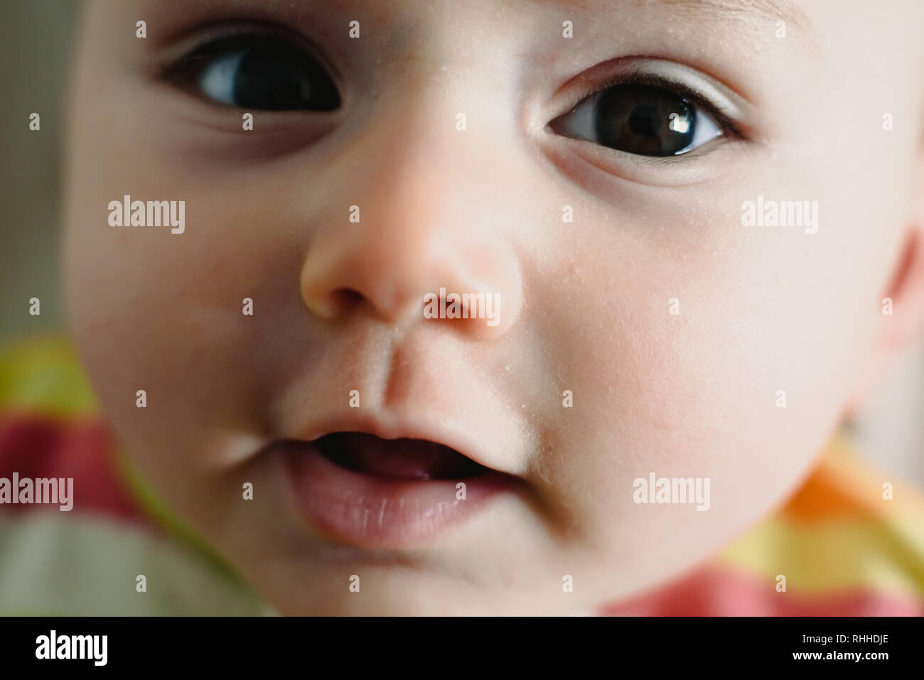 Close-up of a smiling baby's face Stock Photo - Alamy