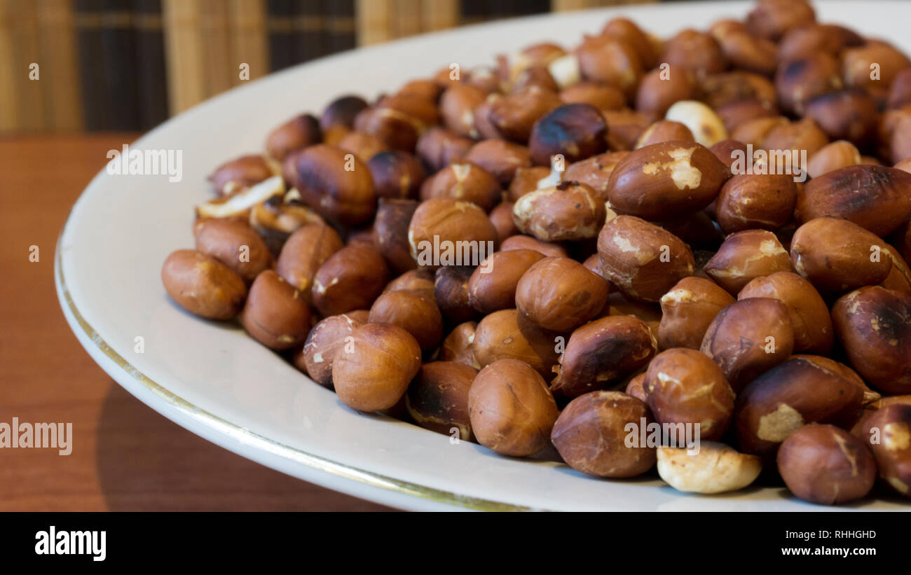 Roasted Peanuts Snack in White Plate in Wooden Backgrounds - Тopview ...