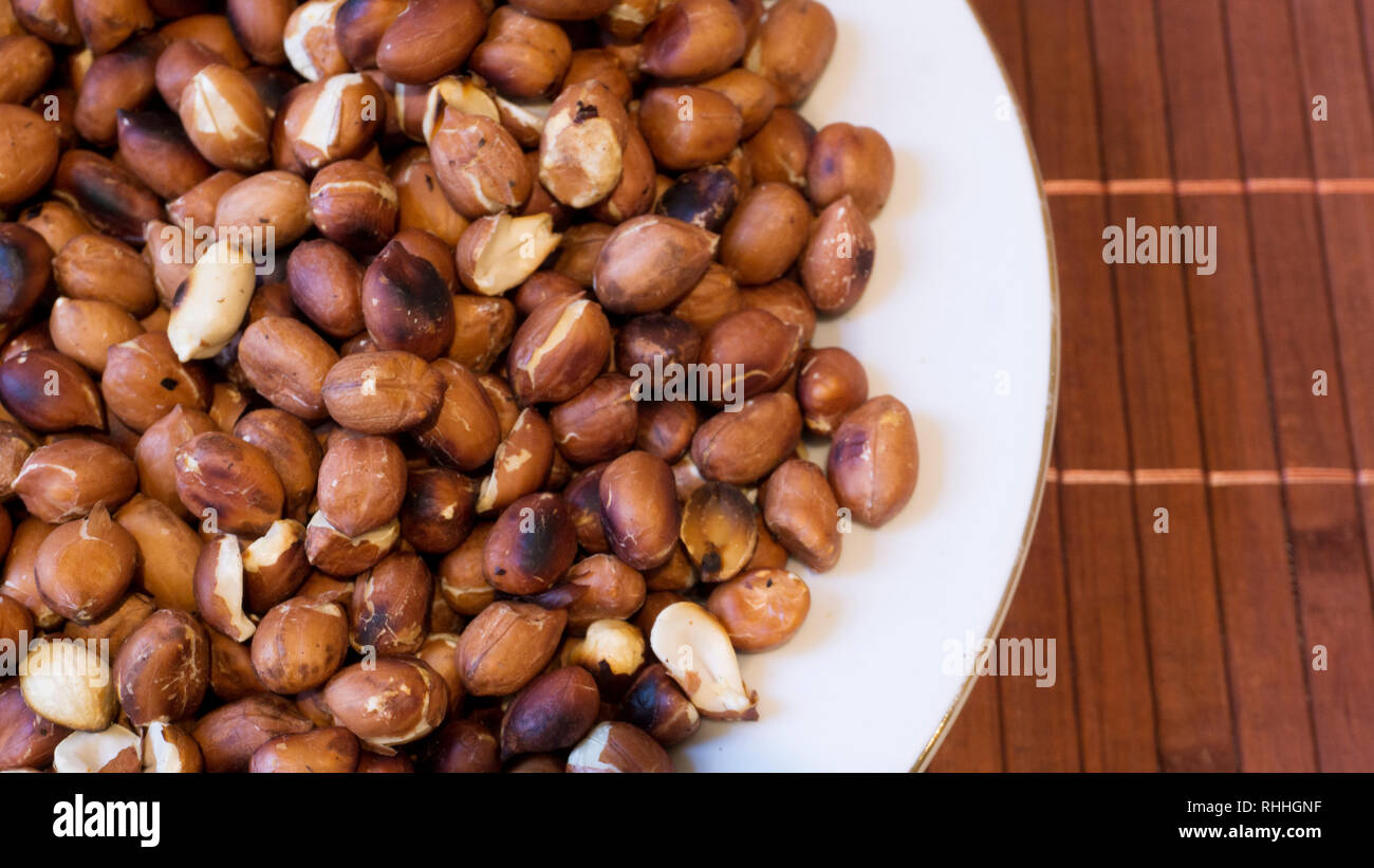 Roasted Peanuts Snack in White Plate in Wooden Backgrounds - Тopview ...