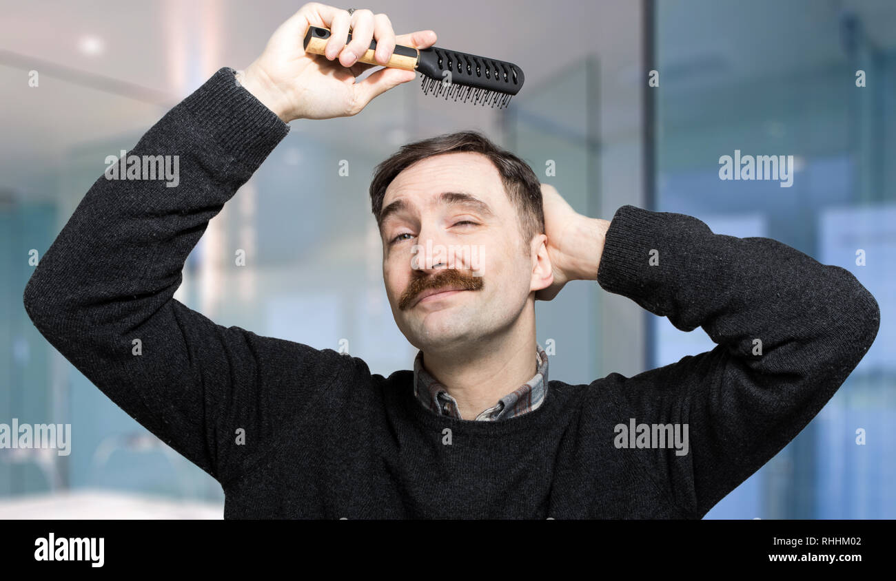 Portrait mature man combing hair hi-res stock photography and images ...