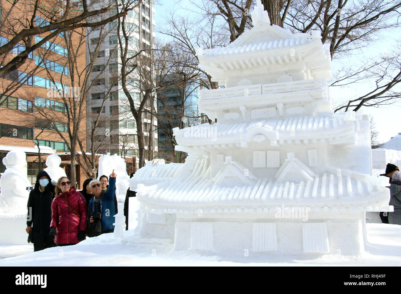Sapporo, Japan. 3rd Feb, 2019. Visitors admire a snow sculpture of a ...