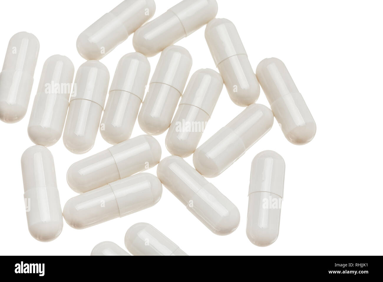 White medicine capsules. Isolate on white background, top view Stock ...