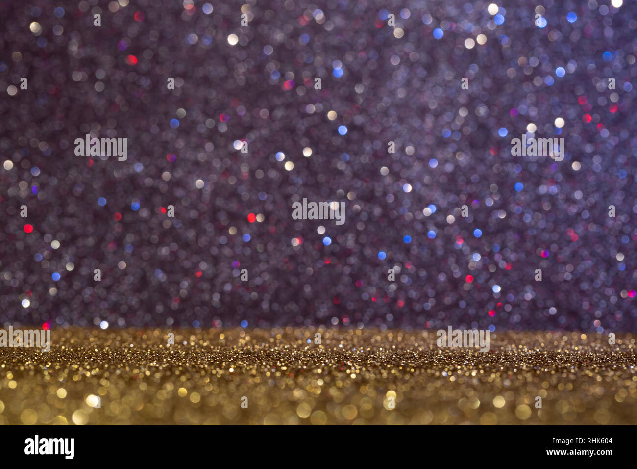 Abstract background filled with shiny bronze and multicolour glitter ...