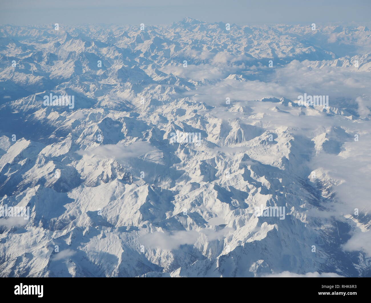 Aerial landscape of the Alps in Europe during winter season with fresh ...