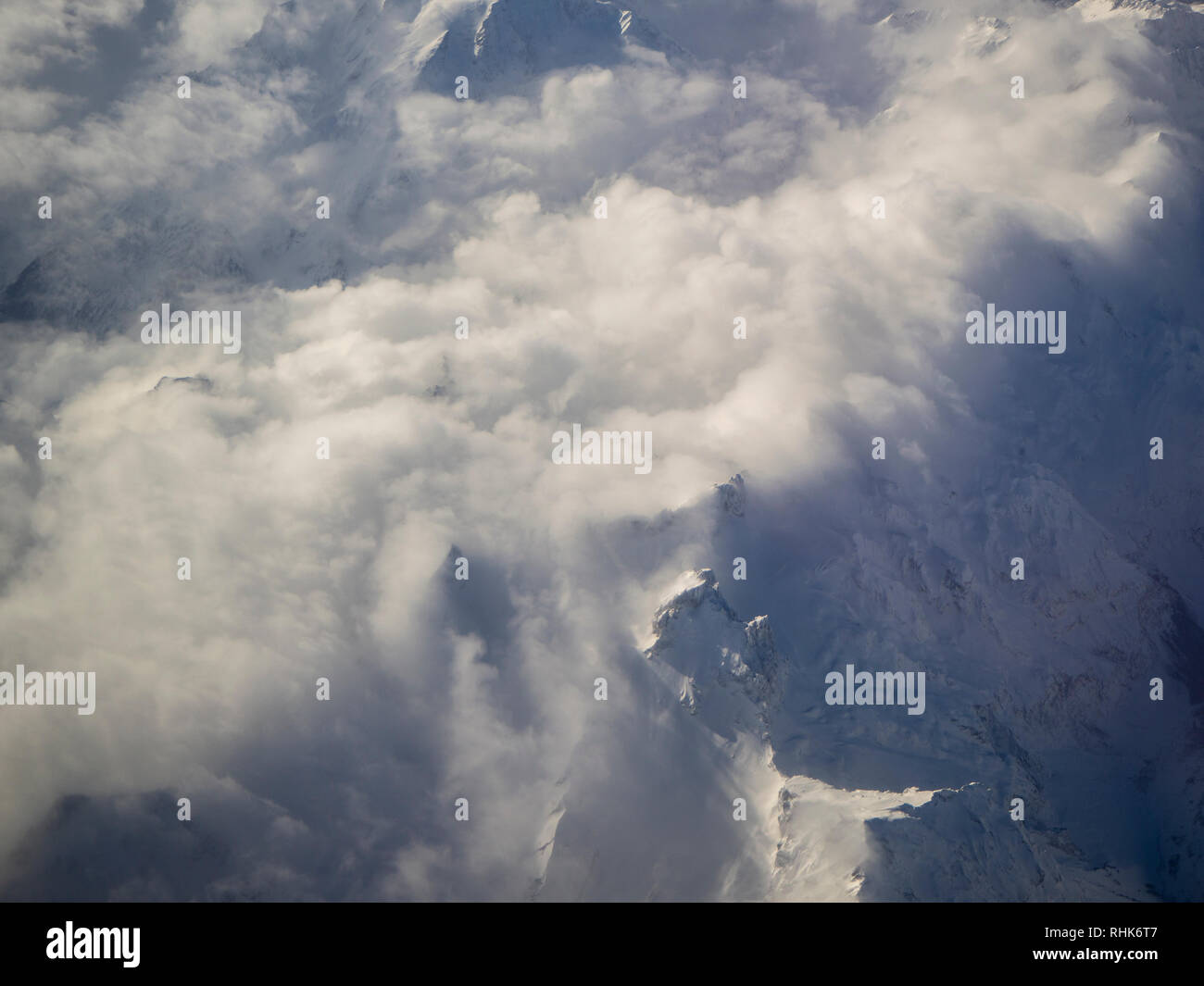 Aerial landscape of the Alps in Europe during winter season with fresh ...