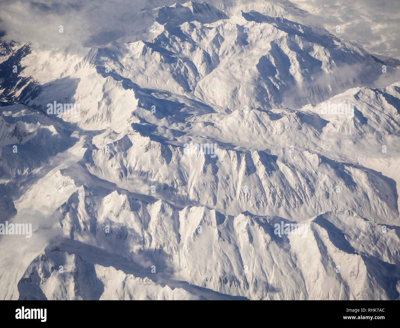Aerial landscape of the Alps in Europe during winter season with fresh ...