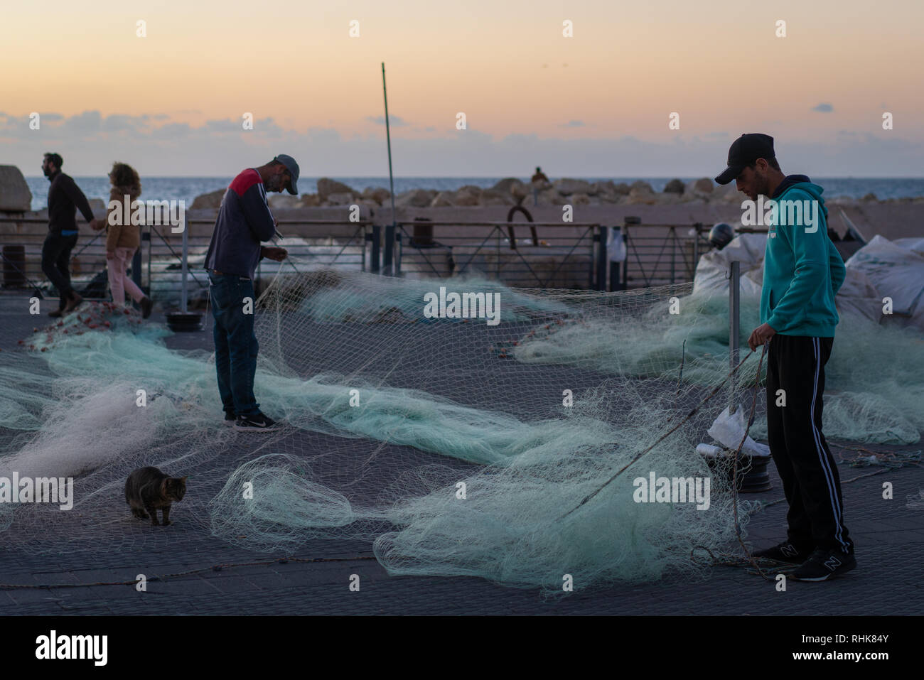 Arab Israeli fishermen work on their nets at Jaffa port Stock Photo - Alamy