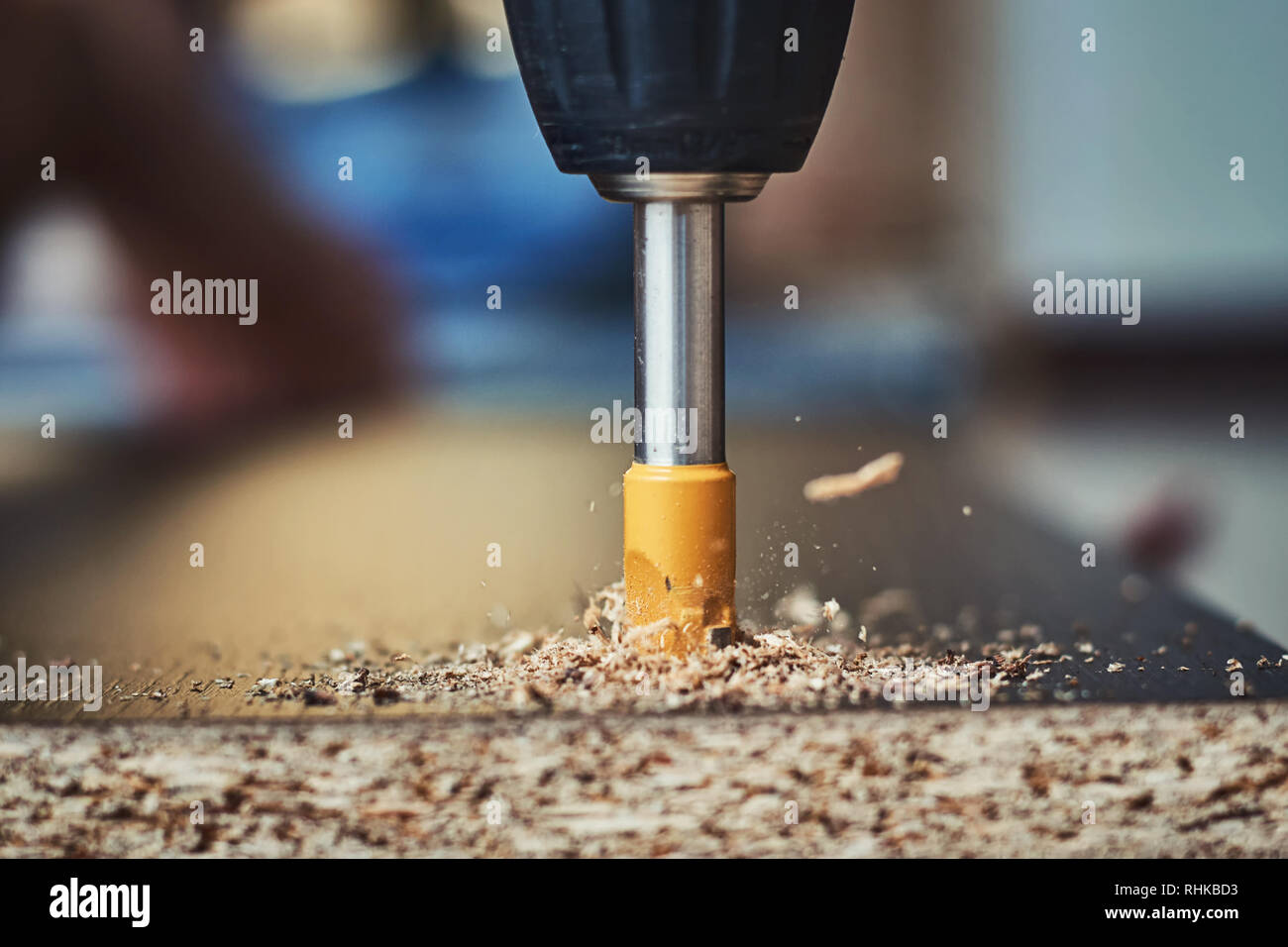 drillig wood with drill bit, wooden processing close up Stock Photo - Alamy