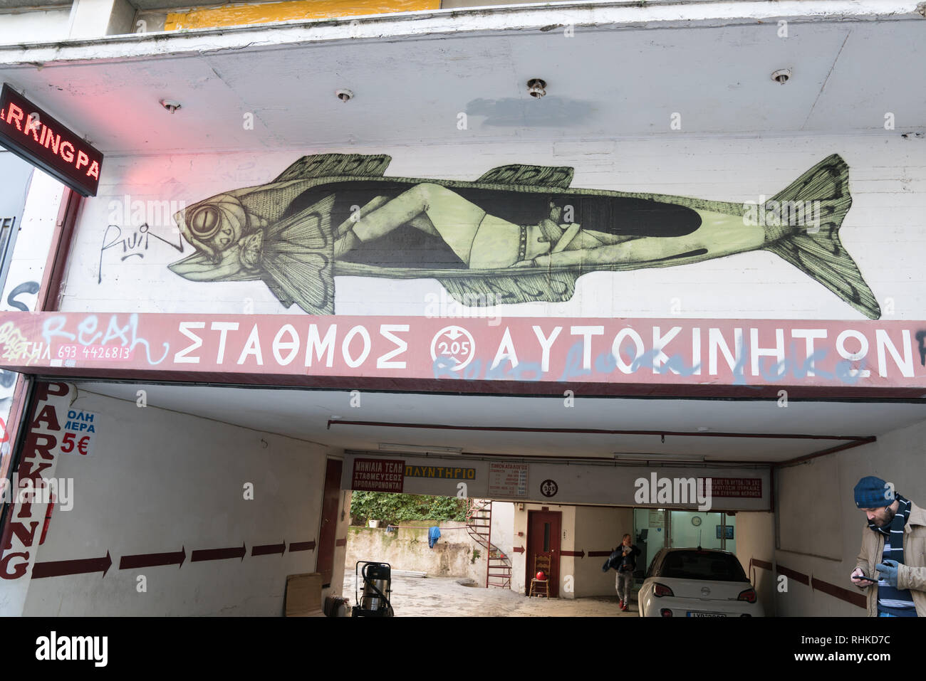 Street art by Ruin. Man inside fish Stock Photo - Alamy