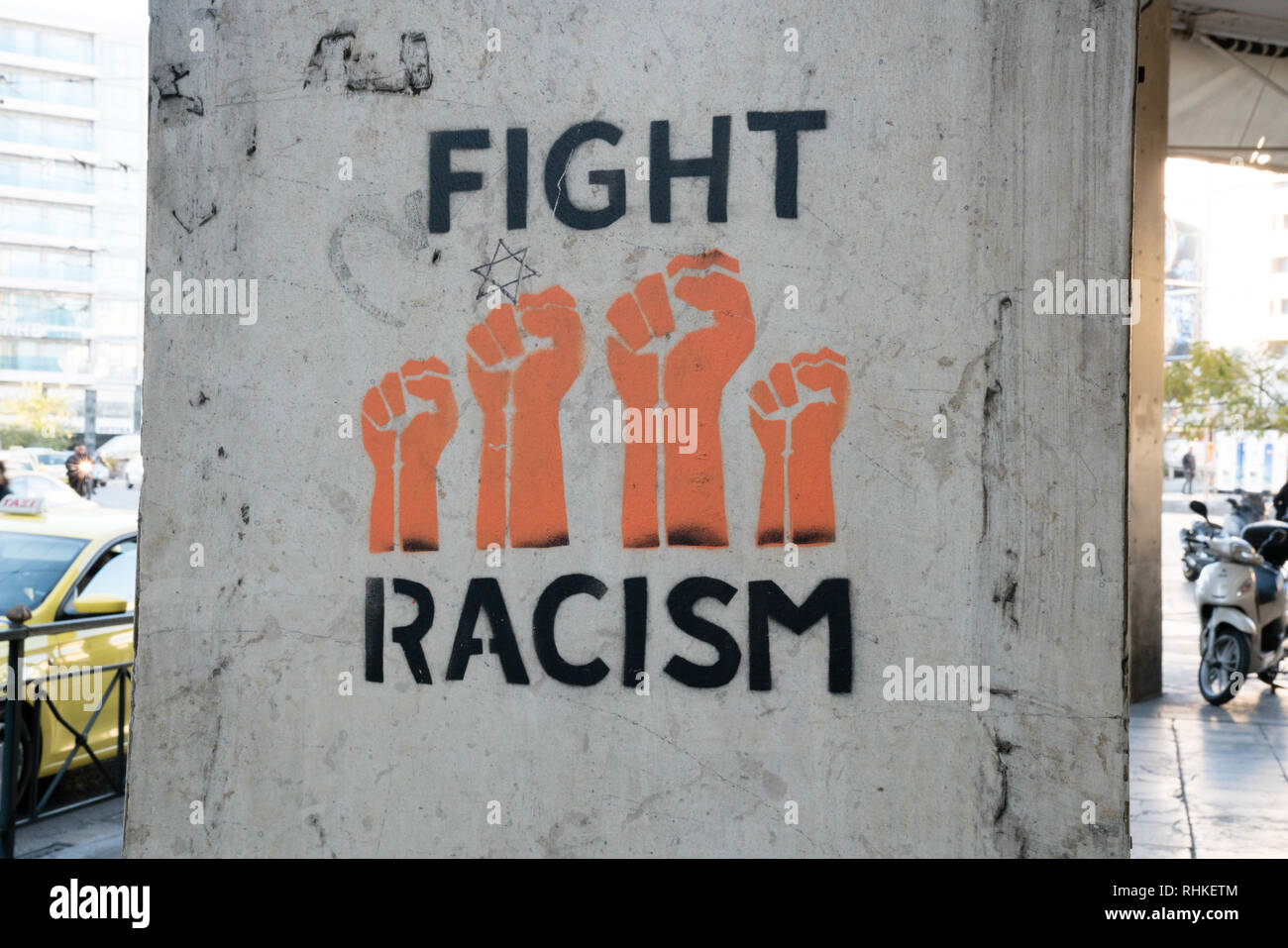 Stencil saying Fight Racism Stock Photo - Alamy