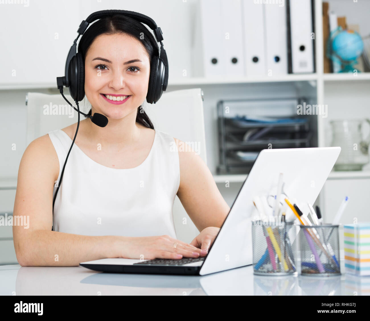 Girl employee having a productive day at call-center Stock Photo - Alamy