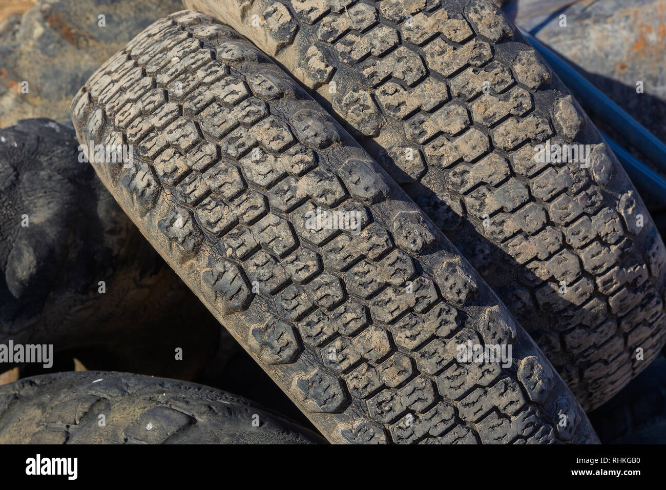 Old tires thrown in a pile Stock Photo - Alamy