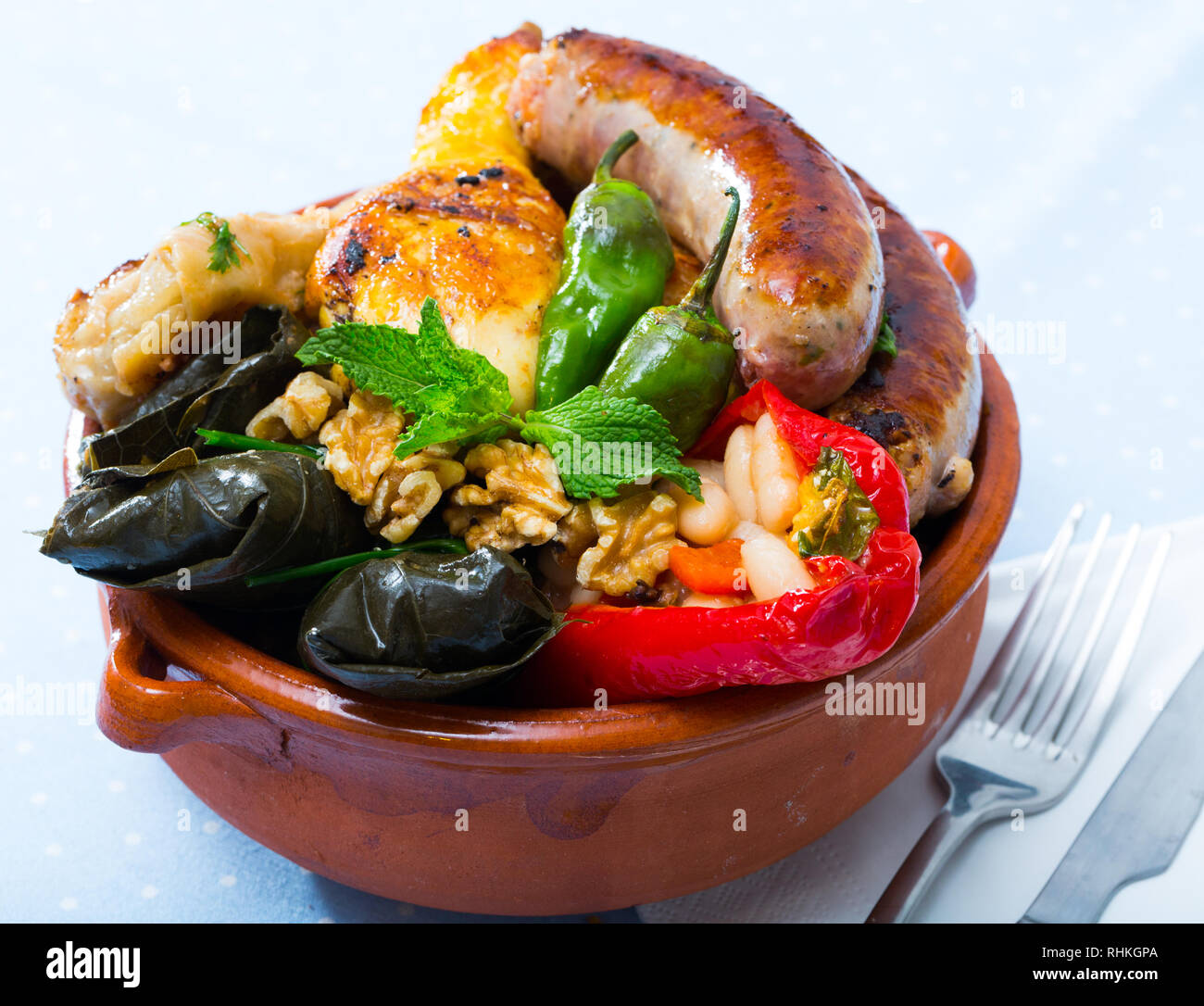 Traditional Bulgarian dish Kapama – sausages, cabbage rolls, dolma and ...