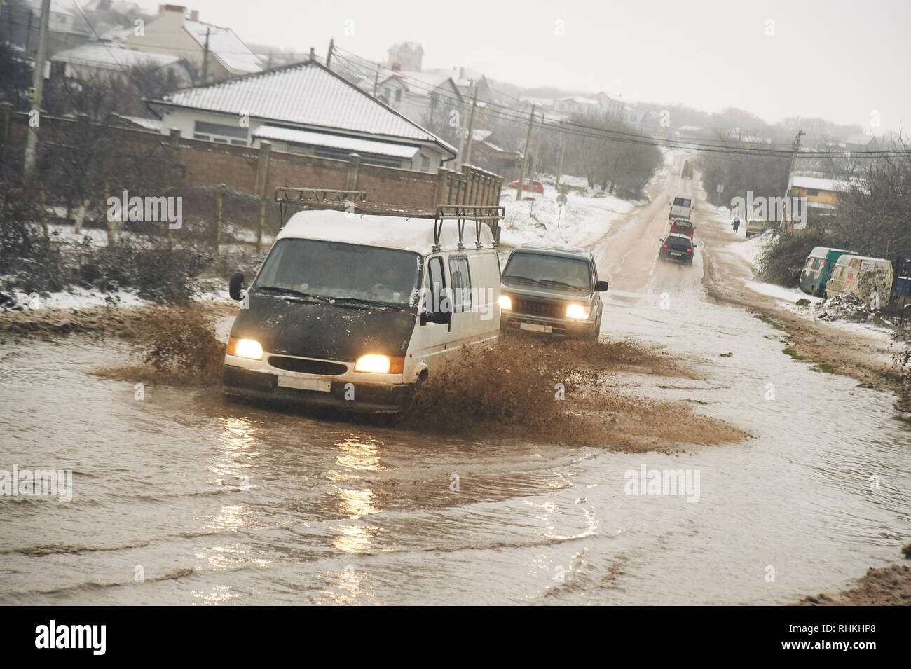 car goes by broken dirty road. bad roads condition problem concept ...