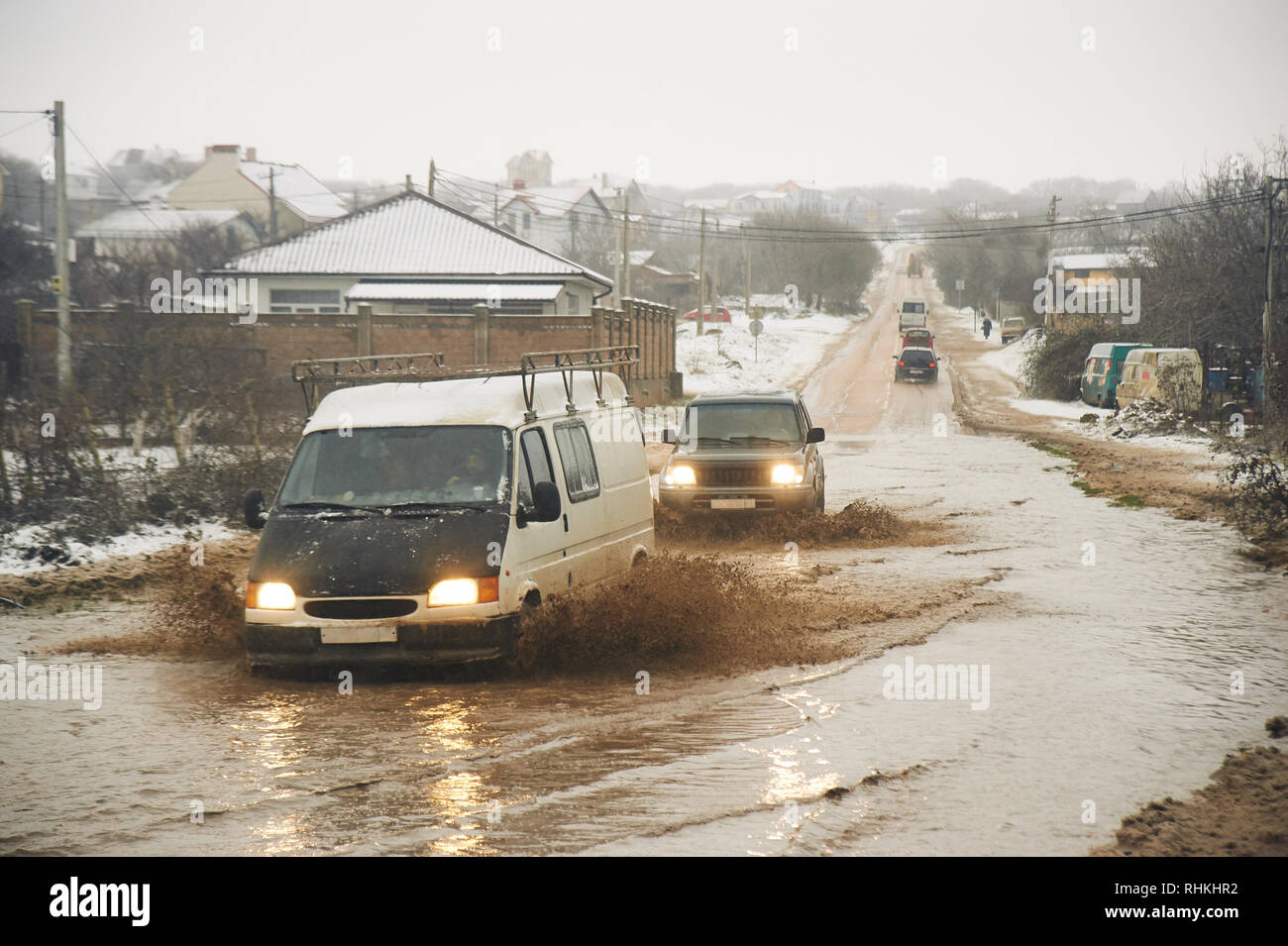 car goes by broken dirty road. bad roads condition problem concept ...
